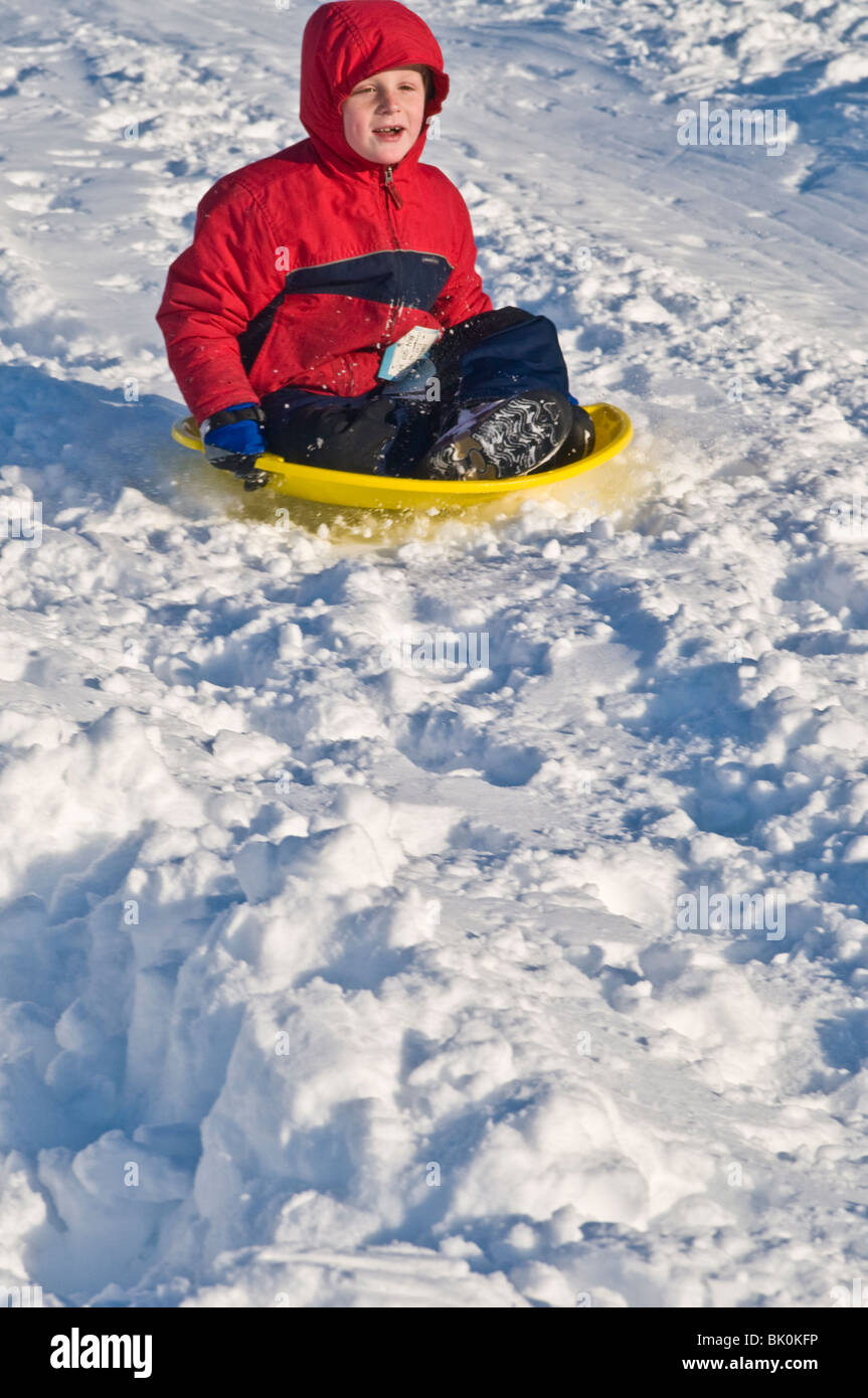 Young families children sleds on snowy city park hillside Stock Photo ...