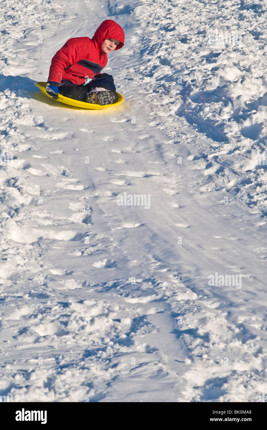 Young families children sleds on snowy city park hillside Stock Photo ...