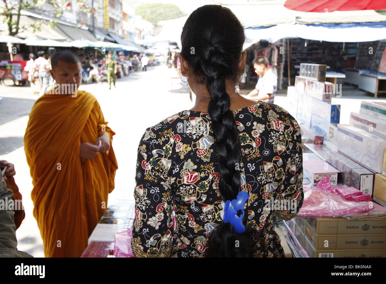 Amonk at a cigarette stall in Tachilek market, Burma, Myanmar Stock ...
