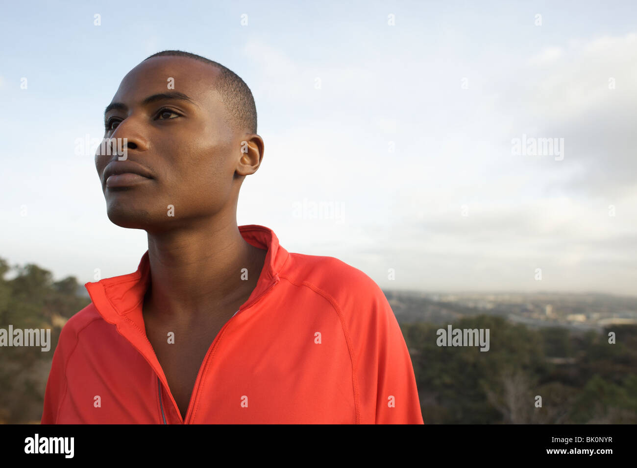 Black man standing outdoors Stock Photo - Alamy