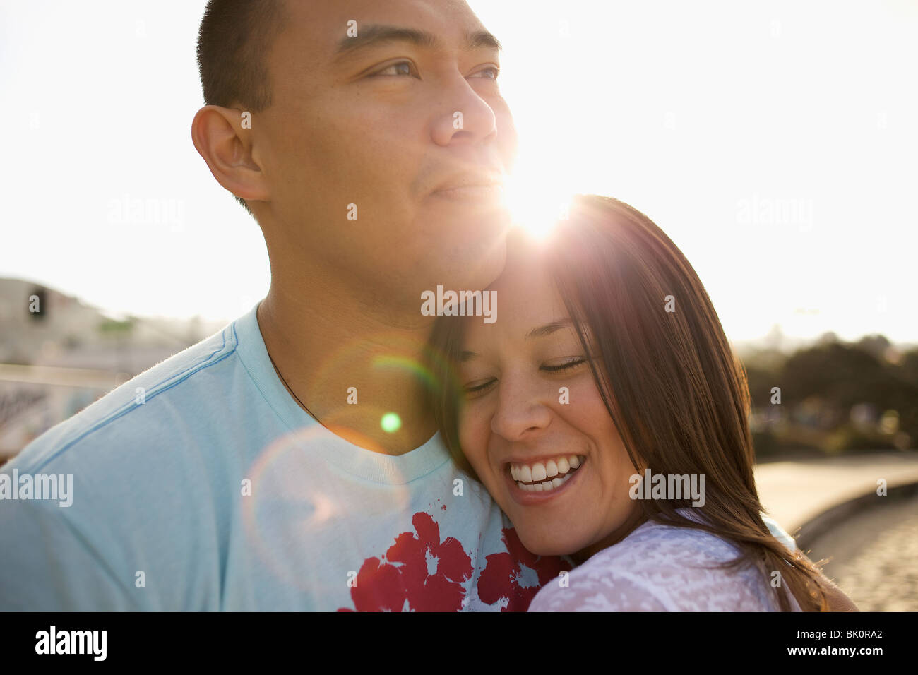 Couple hugging outdoors Stock Photo - Alamy