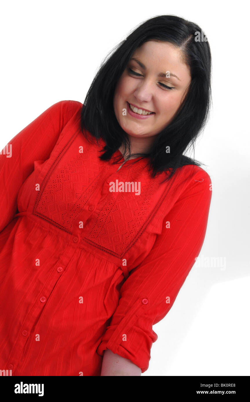 studio Portrait of brunette female in red top Stock Photo - Alamy