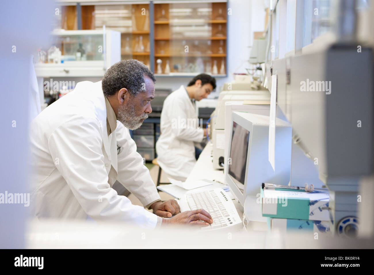 African American scientist working in laboratory Stock Photo - Alamy