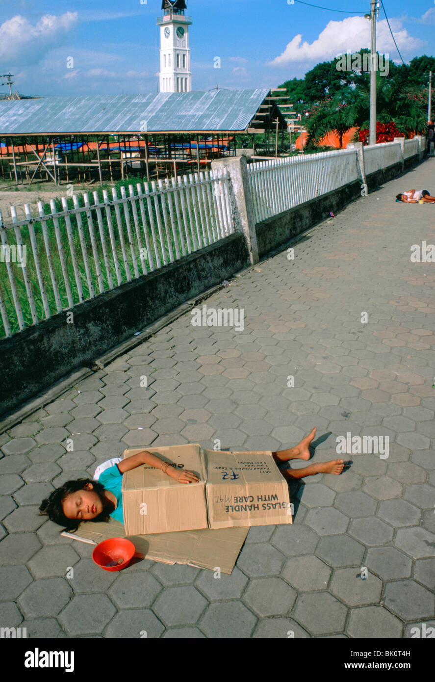 Homeless child sleeping on the street, Bukittinggi, Sumatra, Indonesia ...