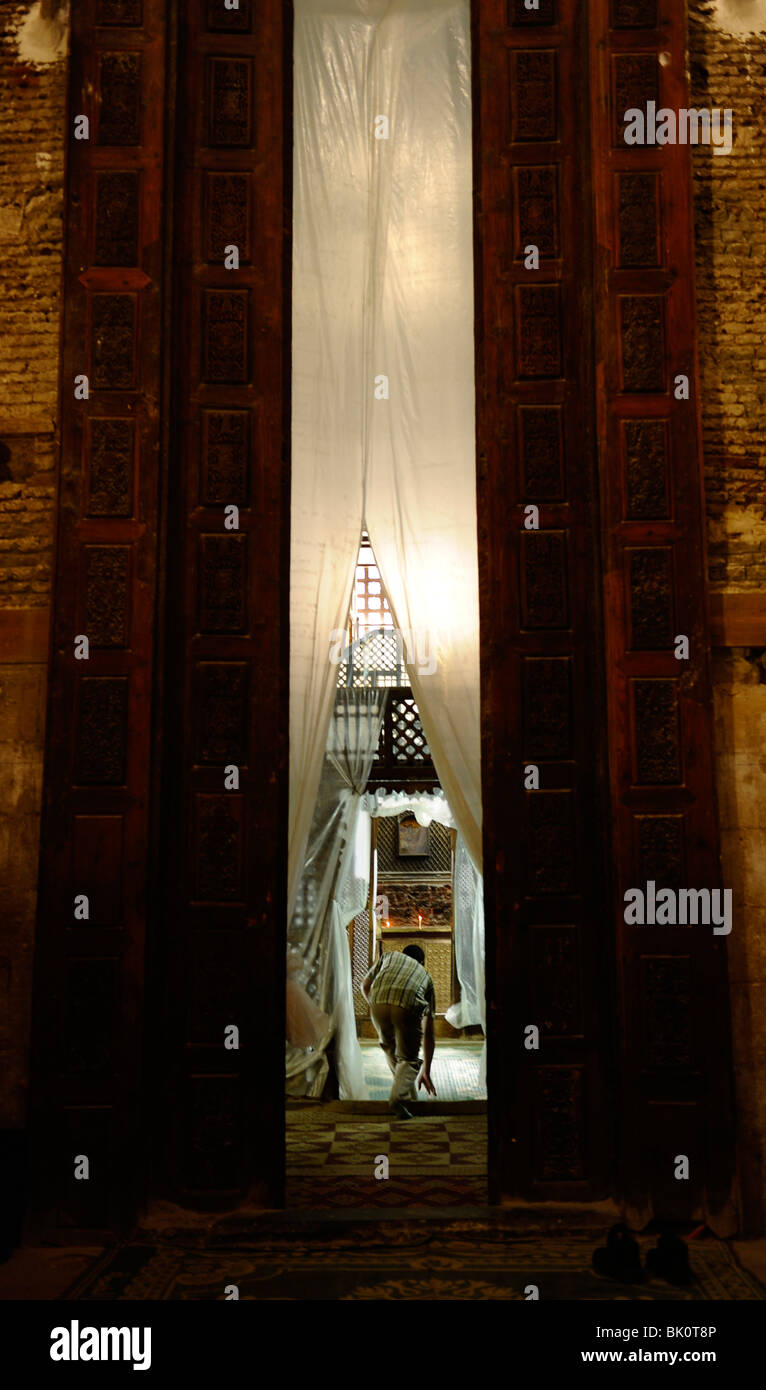man praying at the convent of saint george , coptic cairo , cairo ...