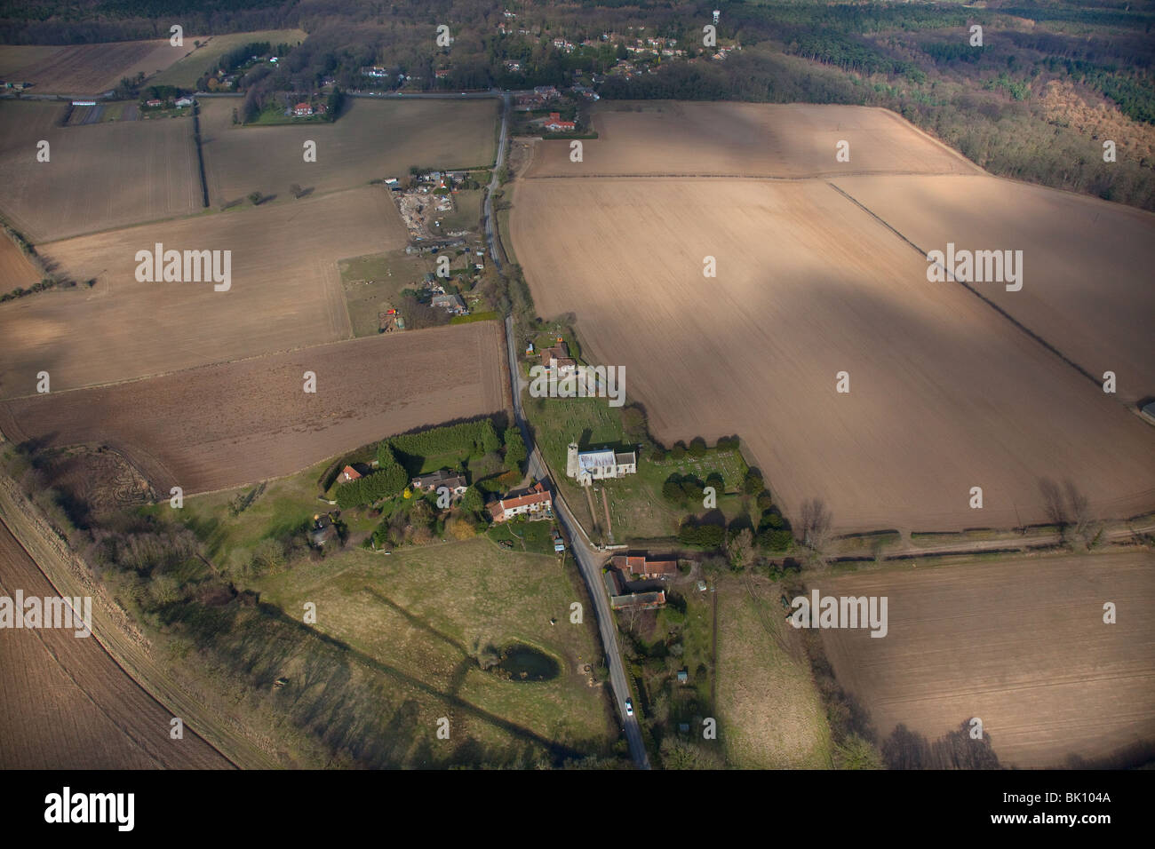 An aerial view of Aylmerton Village Norfolk England Church and winter ...