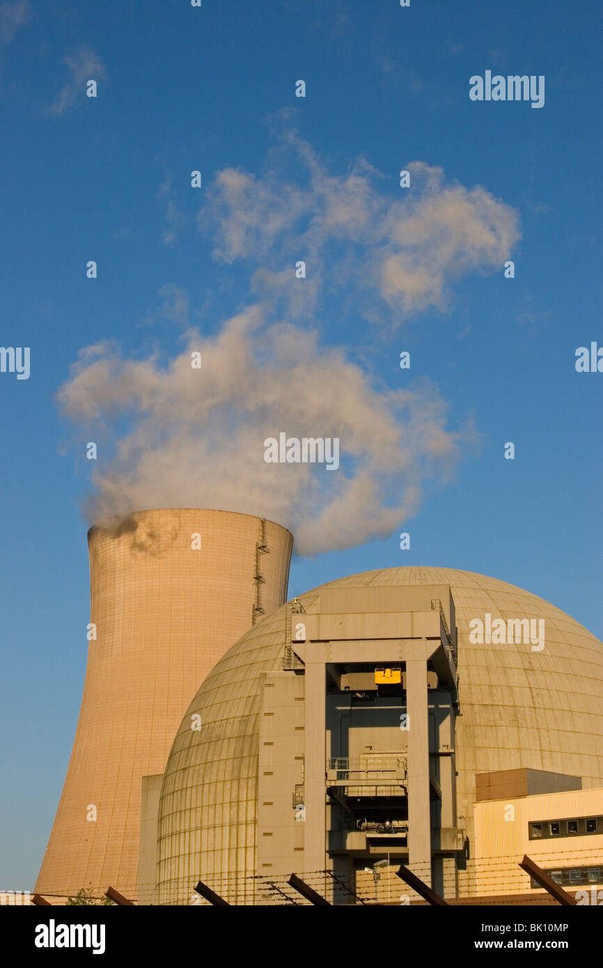 Smoking cooling tower with blue sky Stock Photo - Alamy