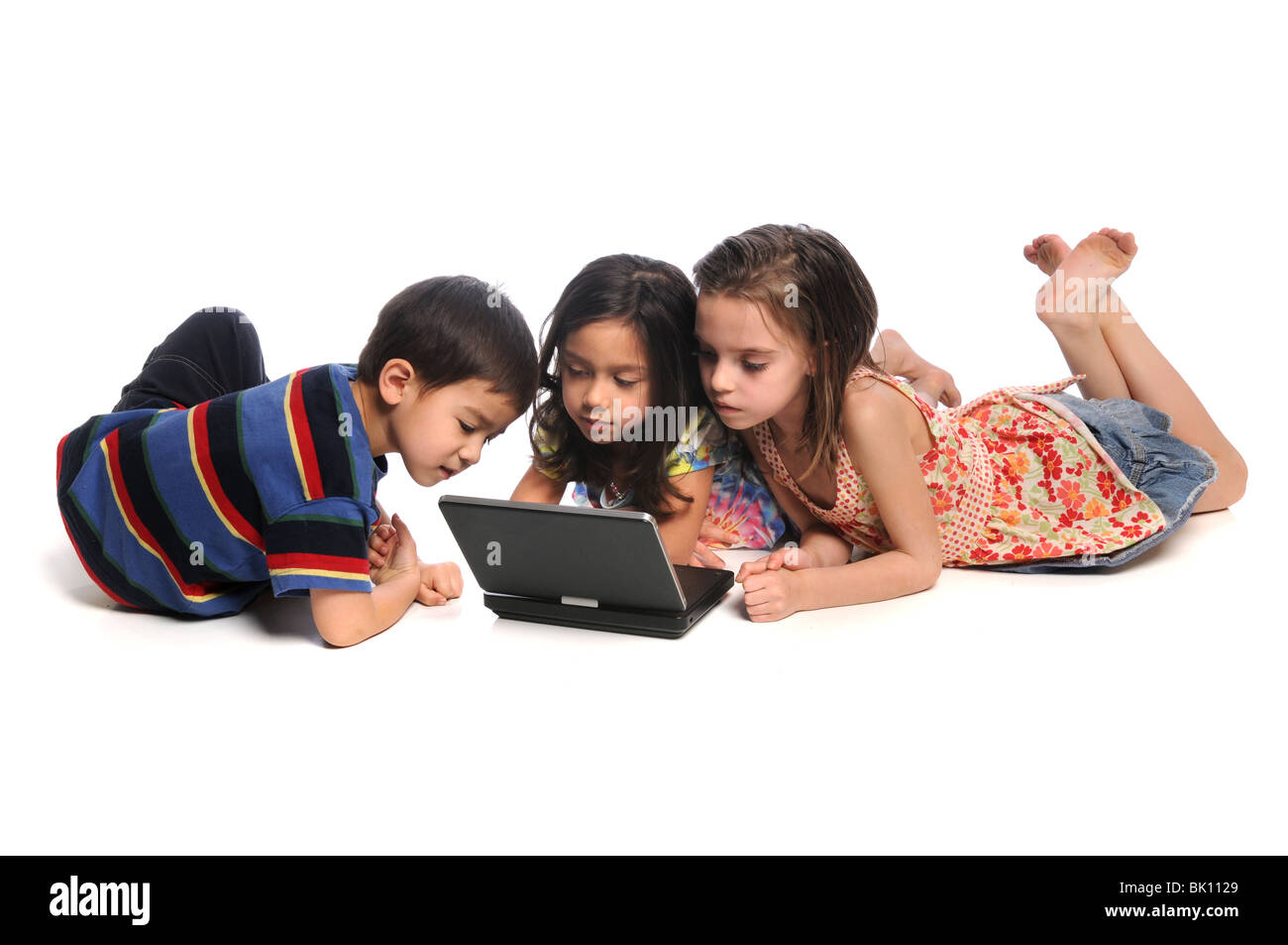Children watching movie on DVD player Stock Photo - Alamy