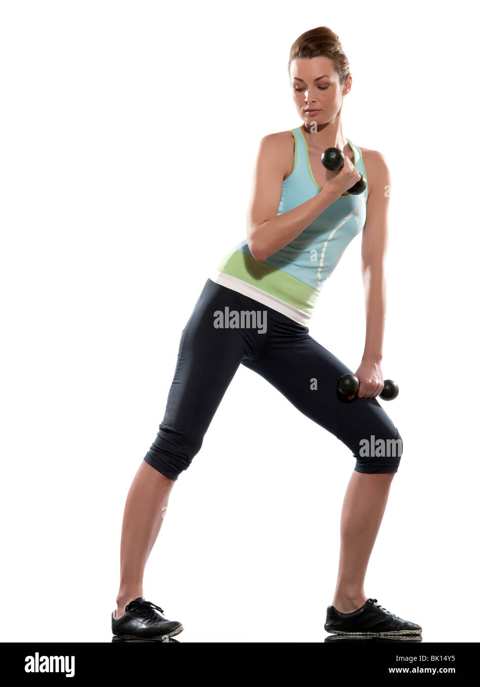 woman doing biceps workout on white isolated background Stock Photo - Alamy