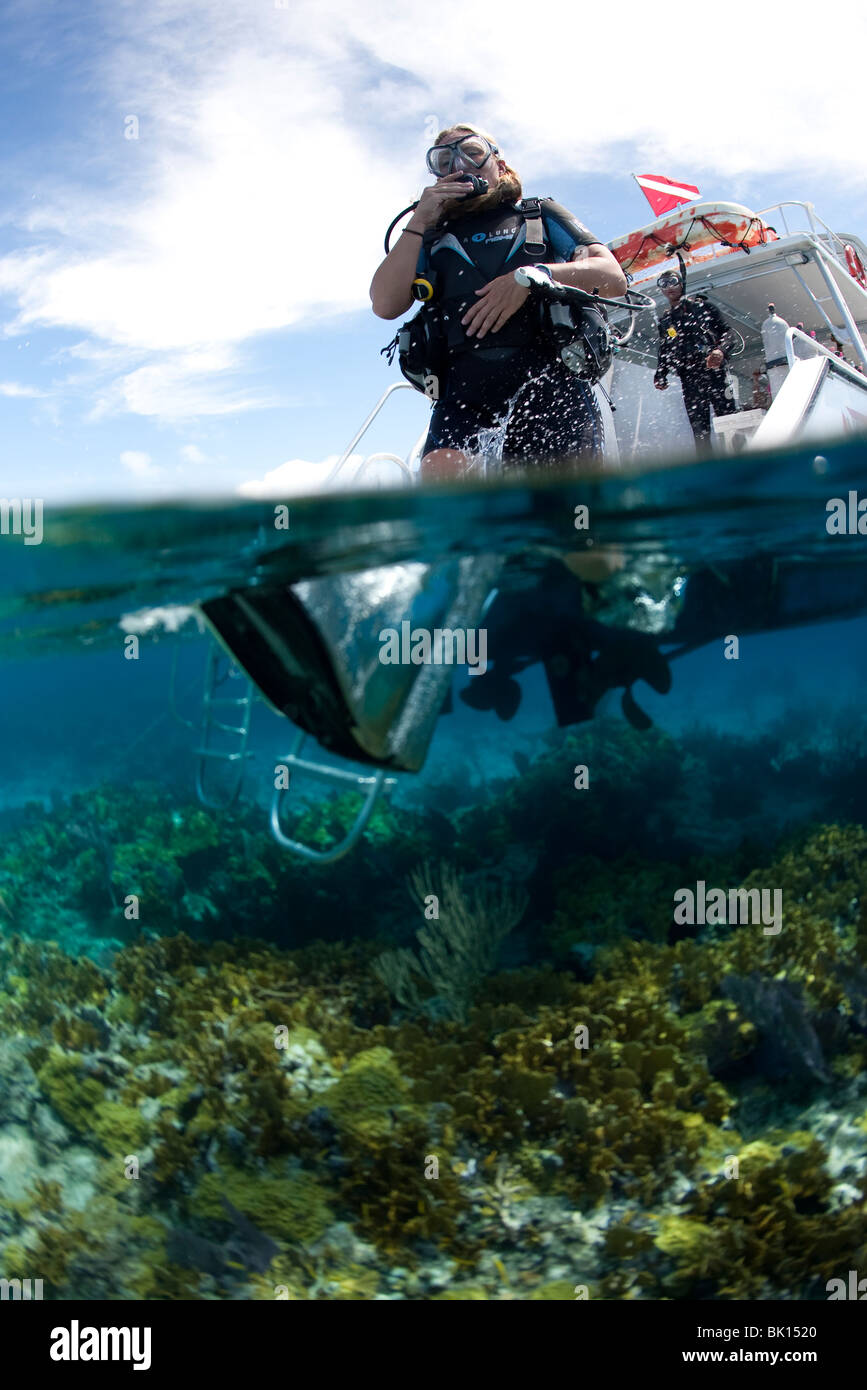 Scuba diver enters water from boat via giant stride entry Stock Photo ...