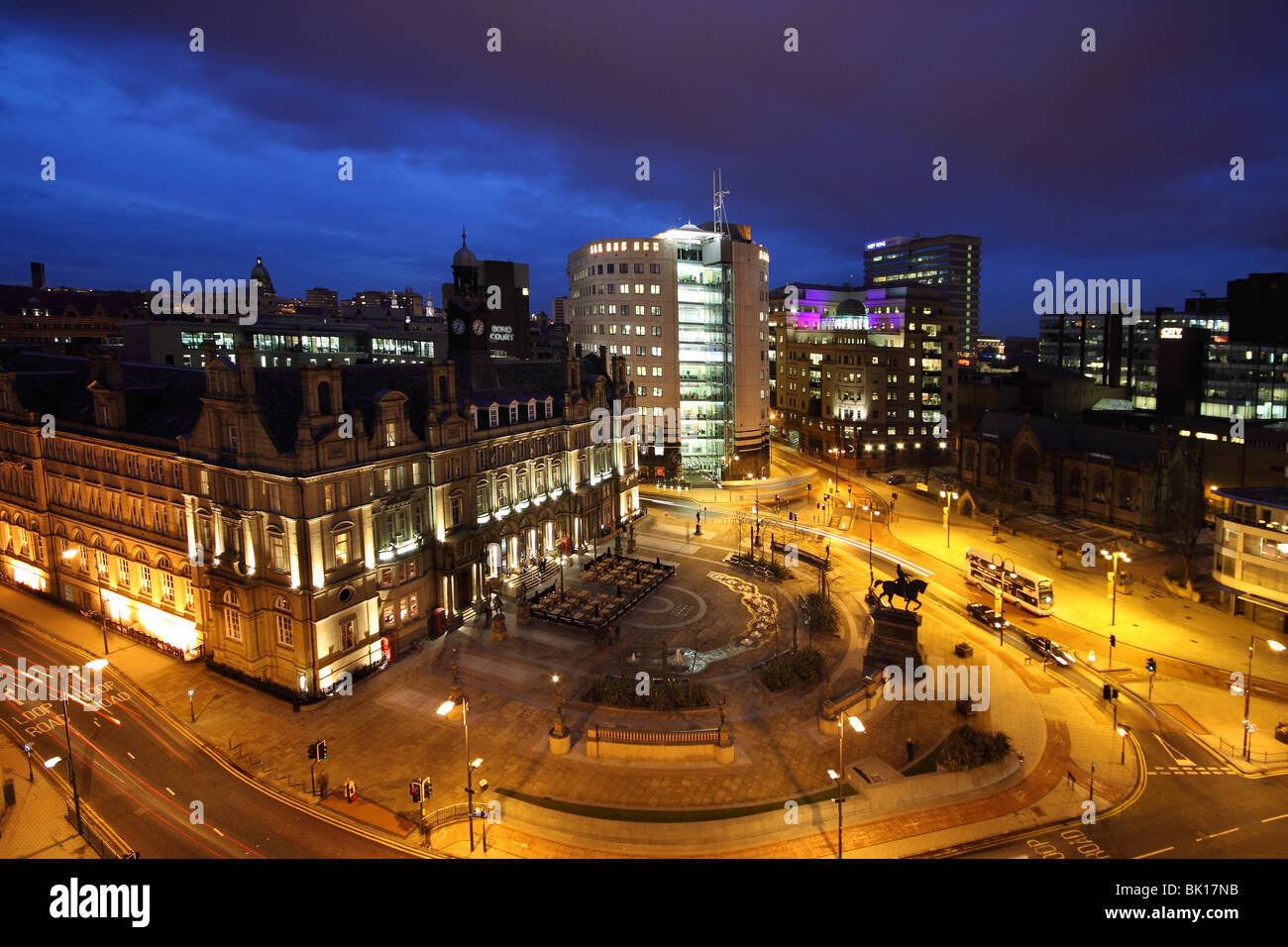 A nighttime view of City Square and the surrounding buildings, in Leeds ...