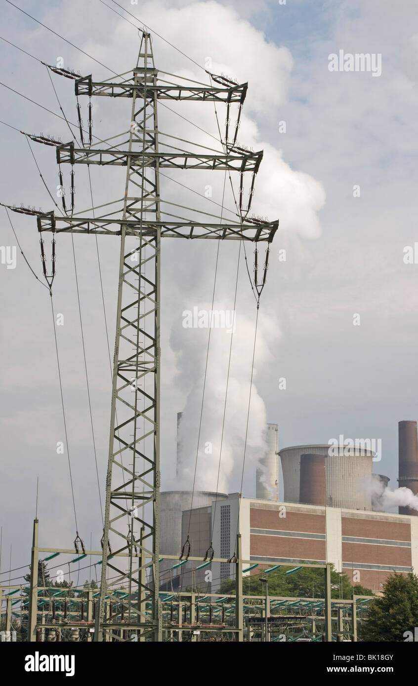 Smoking power plant with pylon Stock Photo - Alamy