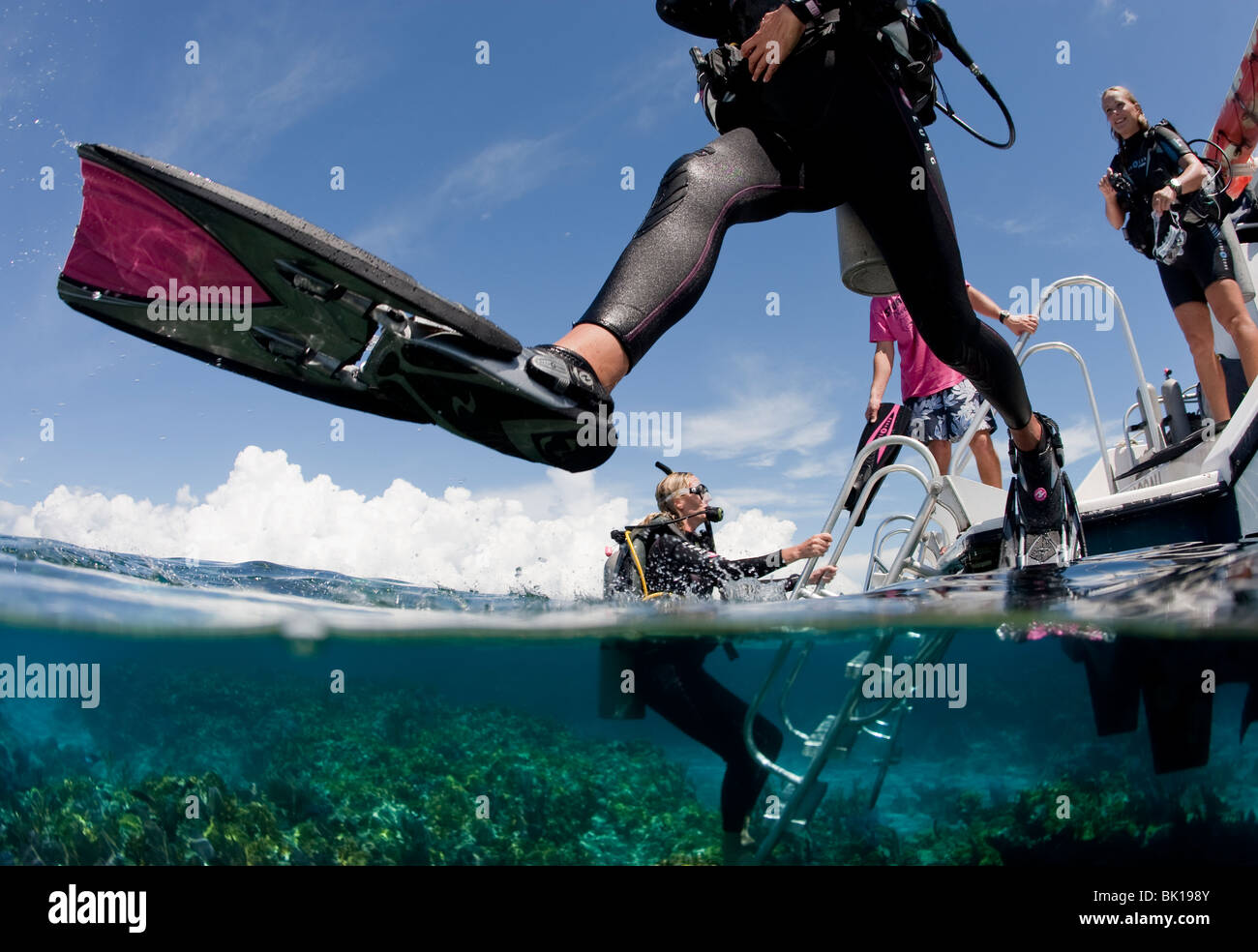 Scuba diver enters water from boat via giant stride entry Stock Photo ...