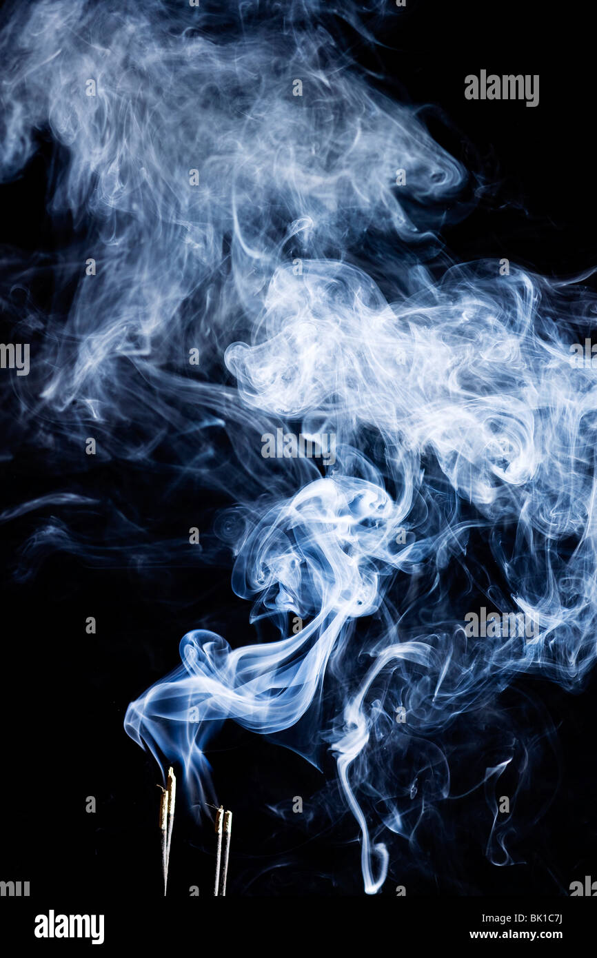 Incense smoke, abstract shape on black background Stock Photo - Alamy