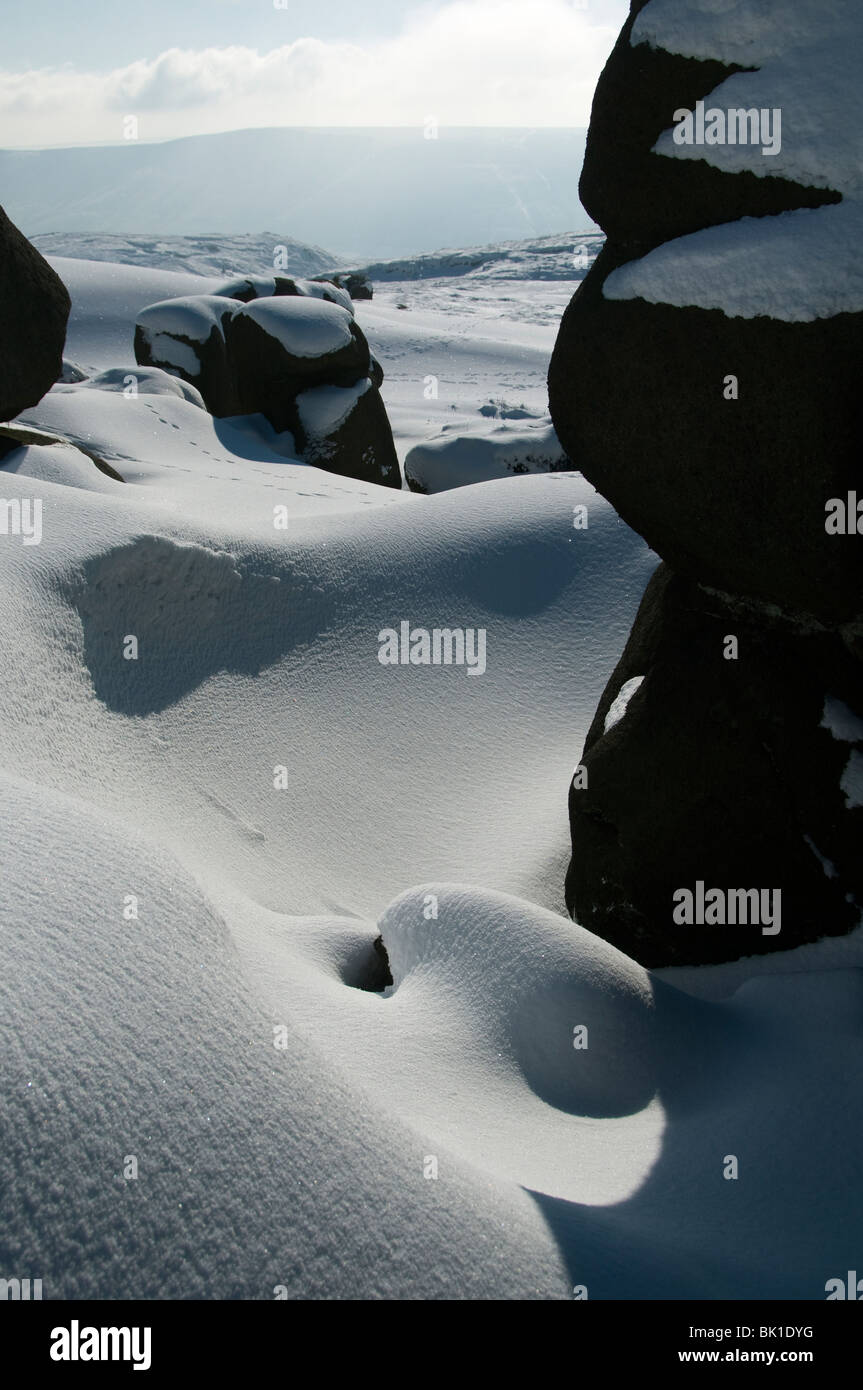 Wind sculpted snow and rocks, at Woolpacks Rocks on Kinder Scout ...