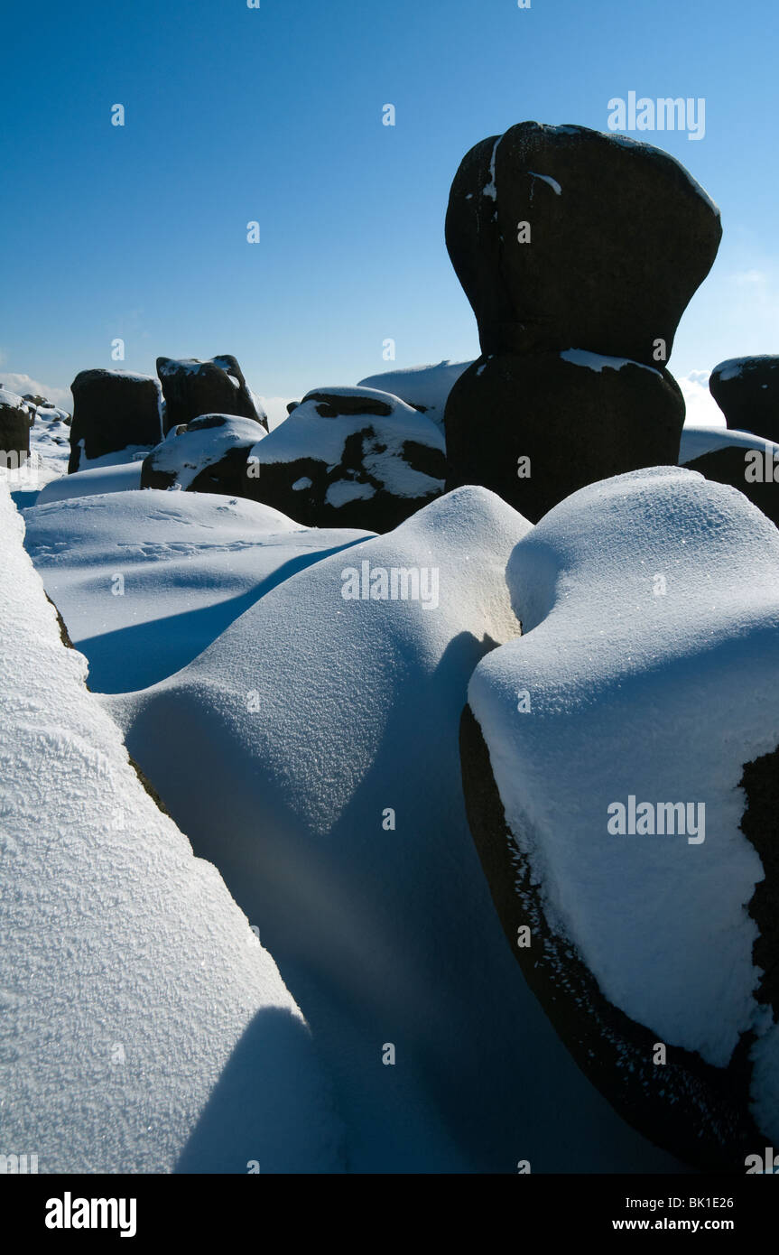 Wind sculpted snow and rocks, at Woolpacks Rocks on Kinder Scout ...