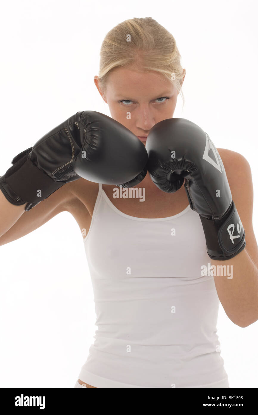 portrait of a young caucasian woman who does kick boxing with boxing ...