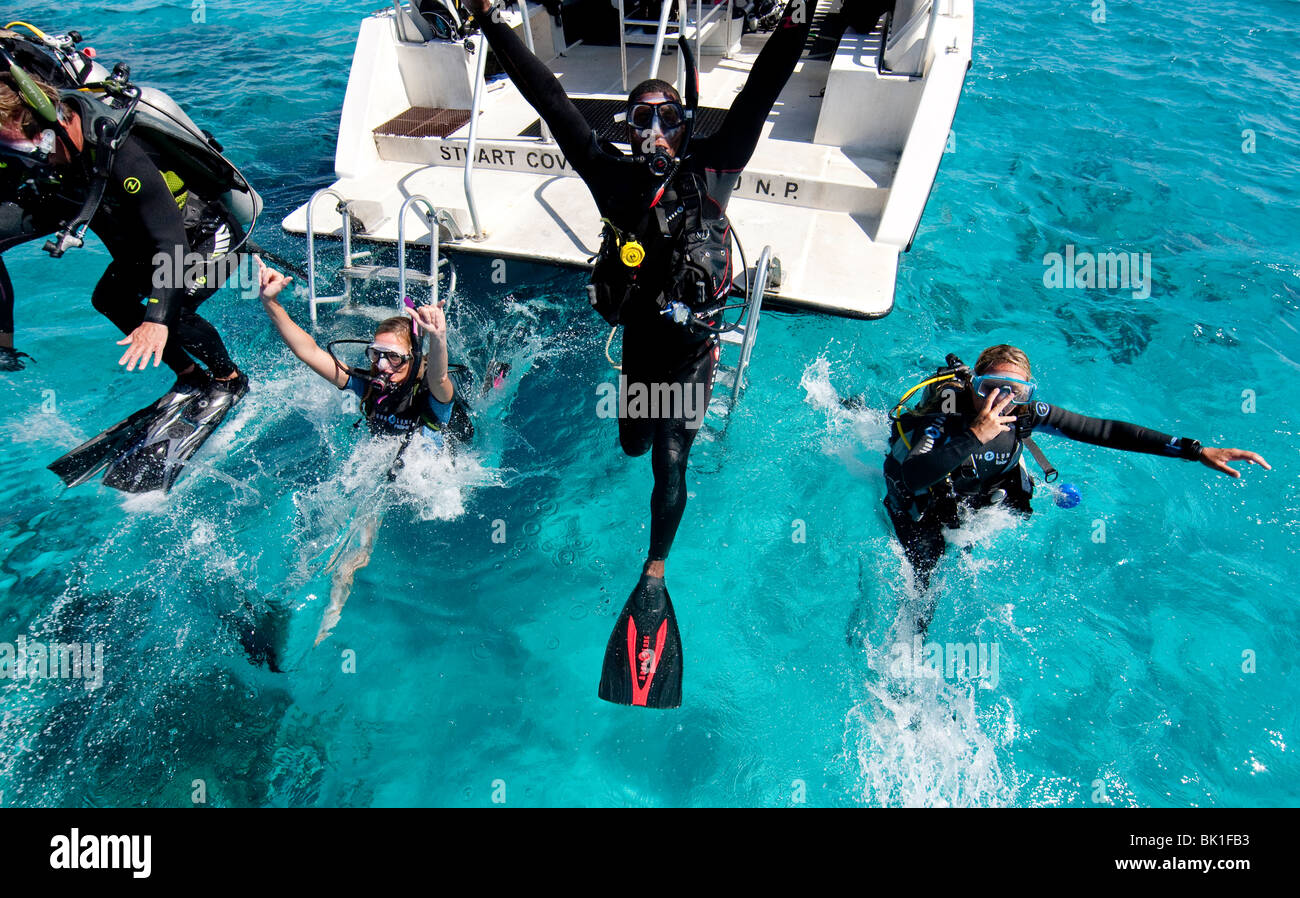 Scuba divers enter water from boat via giant stride entry Stock Photo ...