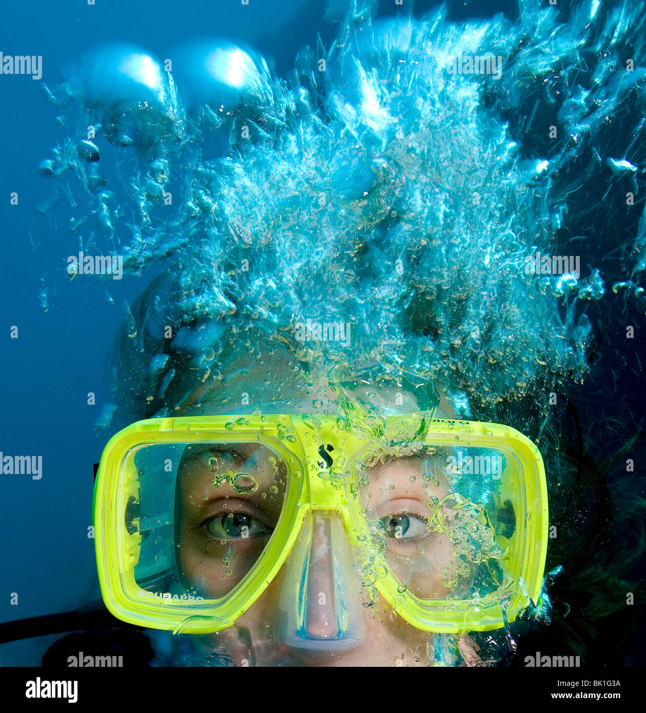 Close up of teenager's face while scuba diving Stock Photo - Alamy