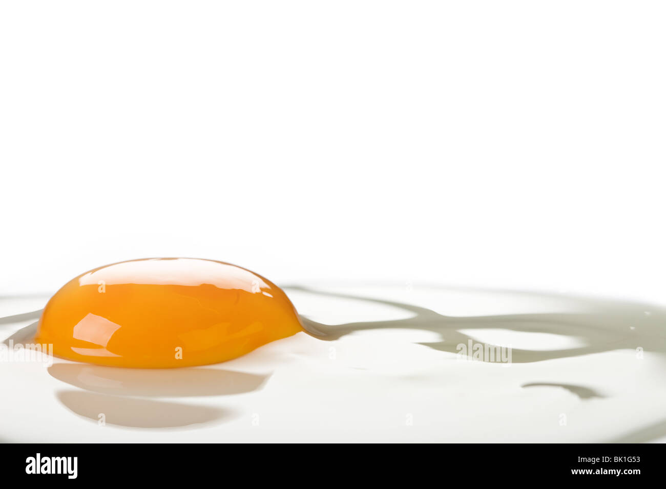 uncooked yolk isolated on white background Stock Photo - Alamy