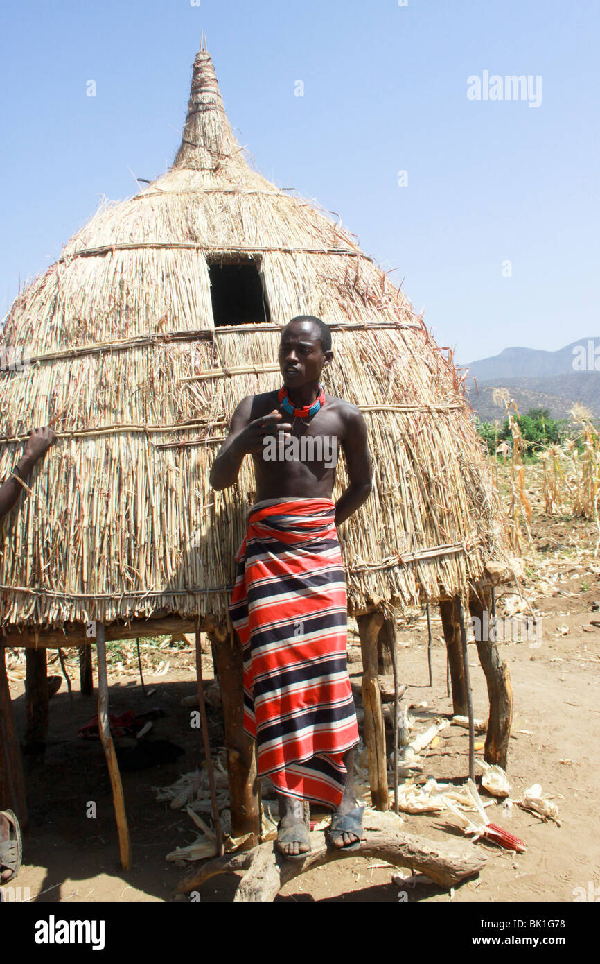 Africa, Ethiopia, Konso tribe man in front of his thatch roof hut Stock ...