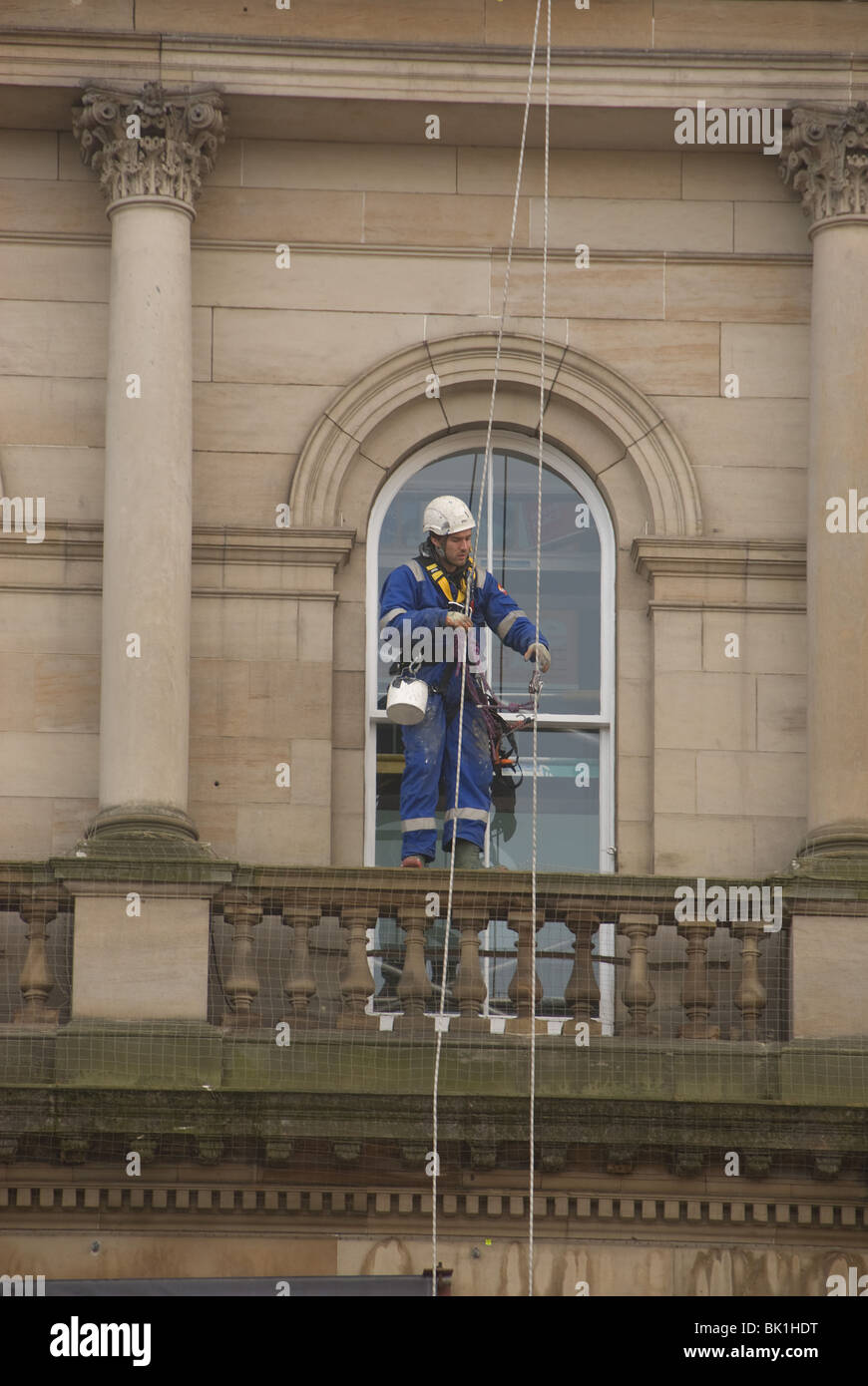 Maintenance worker on Edinburgh hotel Stock Photo - Alamy