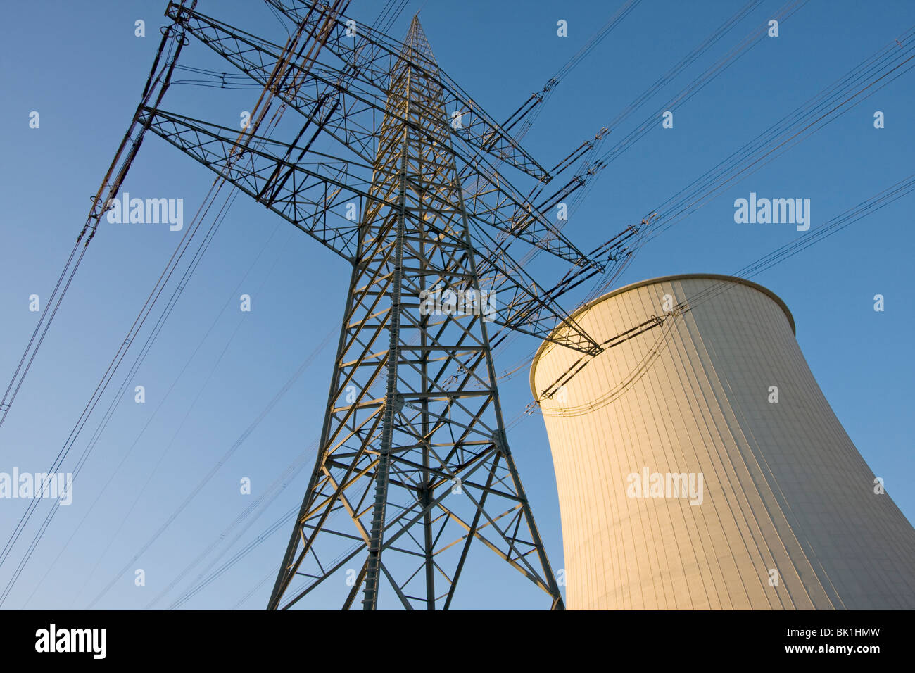 Power pole with cooling tower Stock Photo - Alamy
