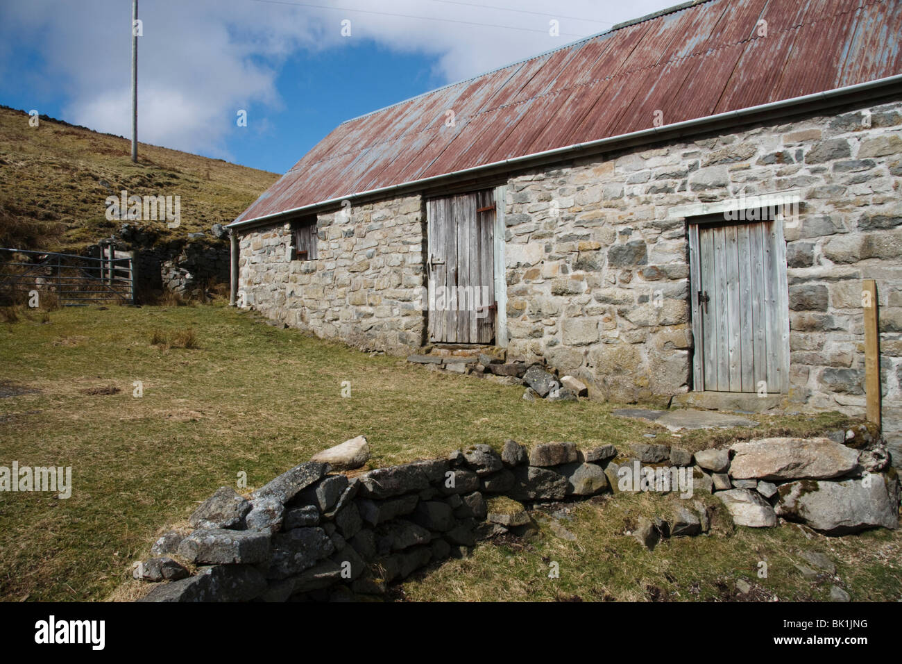 Stone built farm building with tin roof, Mid Wales Stock Photo - Alamy