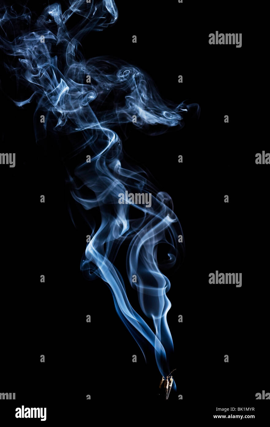 Incense smoke, abstract shape on black background Stock Photo - Alamy