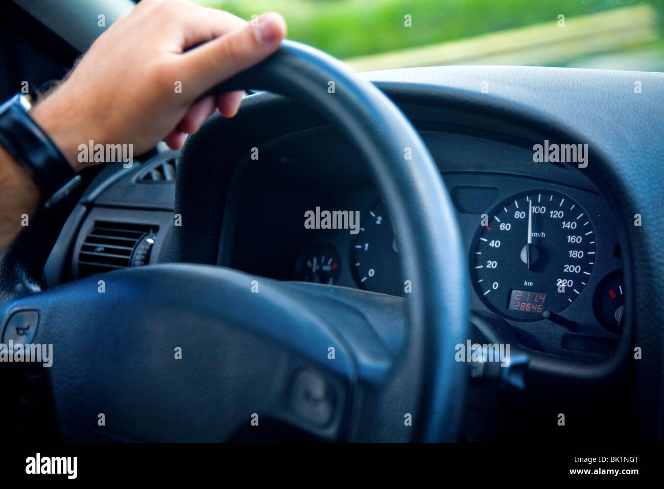 Hand of man driving a car Stock Photo - Alamy