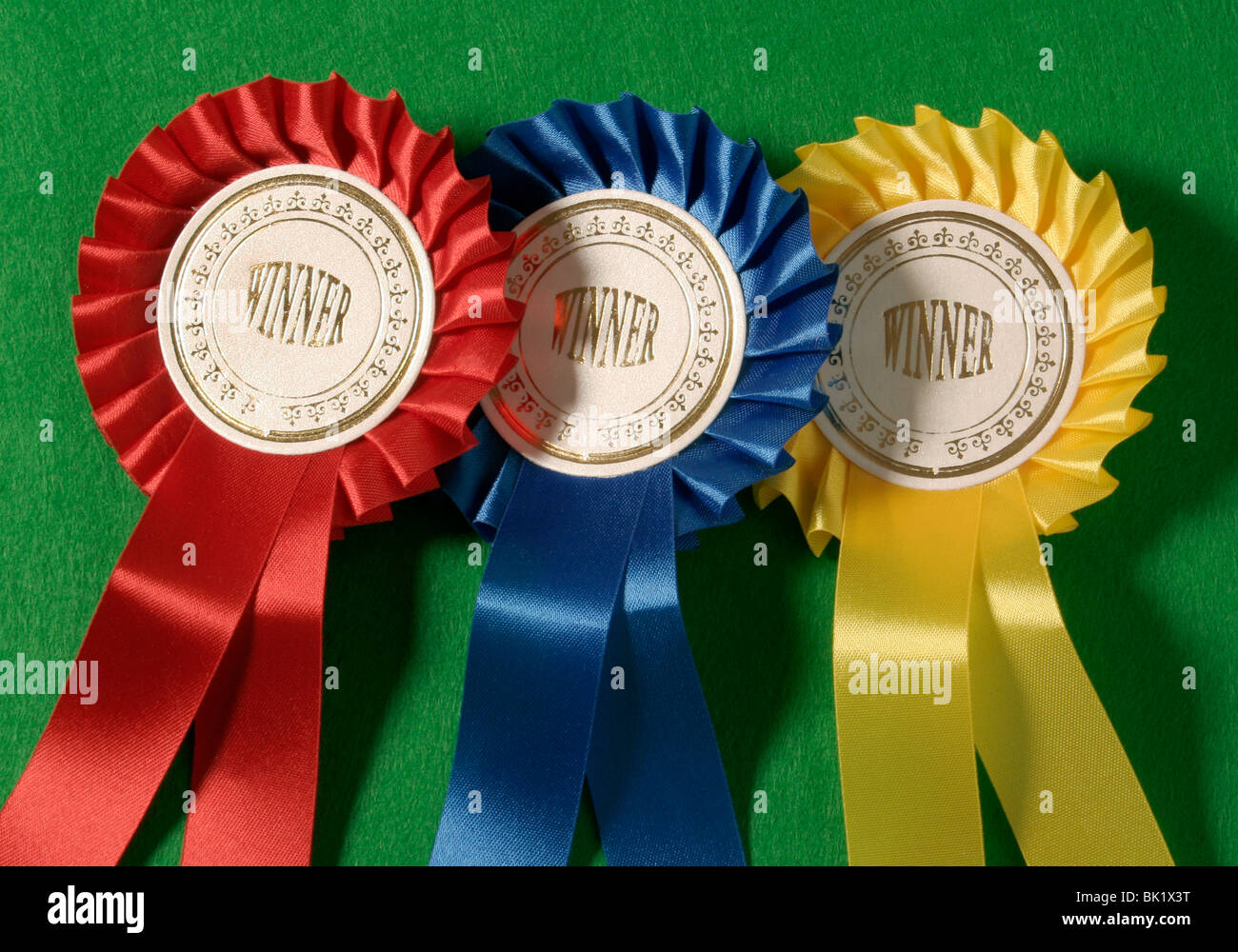 Blue,Yellow and Red winners Rosettes Stock Photo - Alamy