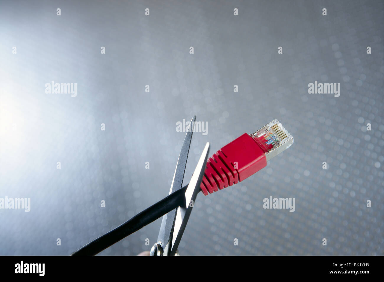 Cutting with wired technology metaphor, ethernet RJ45 cable scissors ...