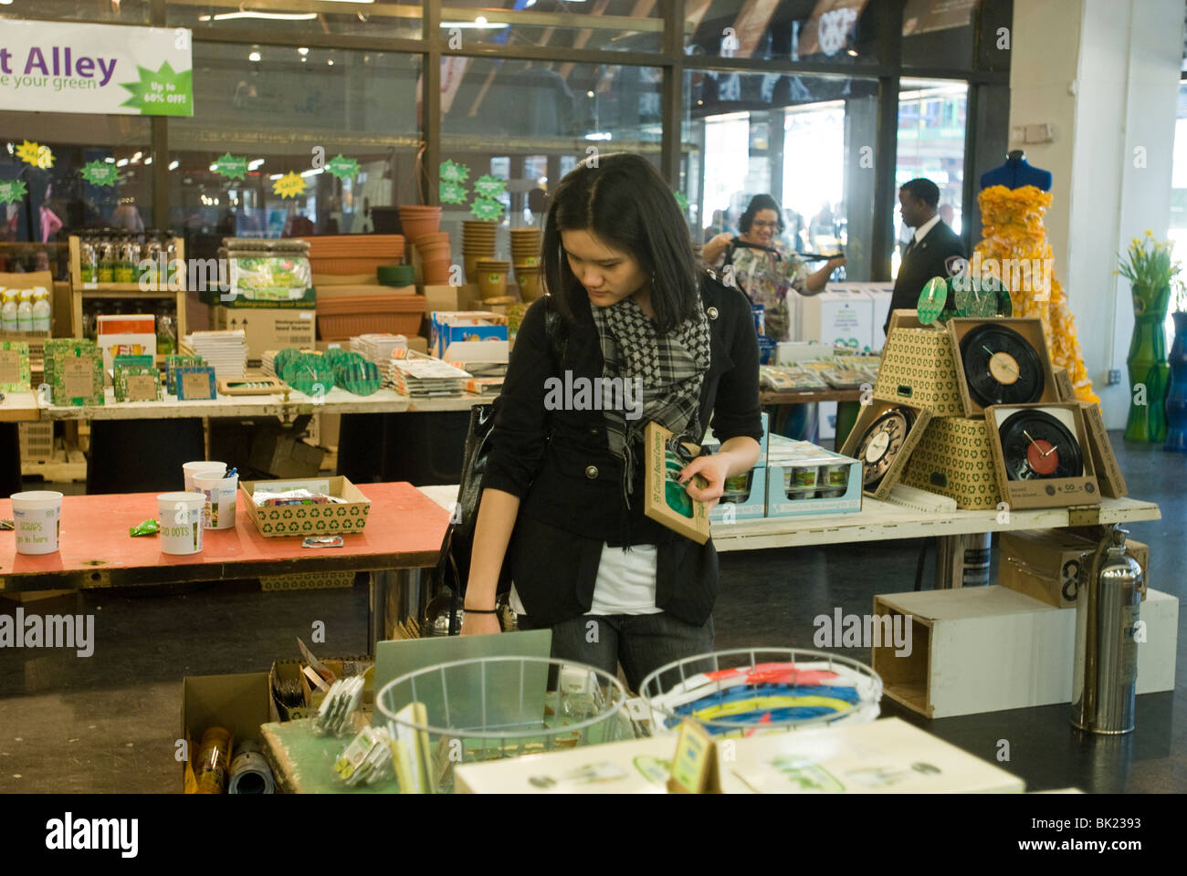 Shoppers browse merchandise made from recycled products at the Green Up ...