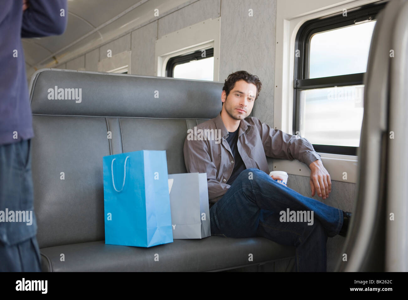 Bag on train seat man hi-res stock photography and images - Alamy
