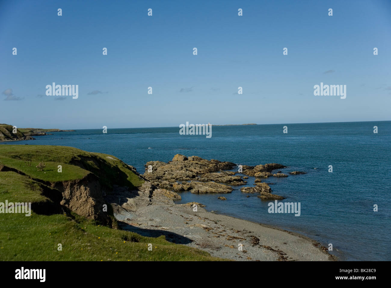 Skerries Lighthouse and Carmel Head from the Anglesey coastal path ...