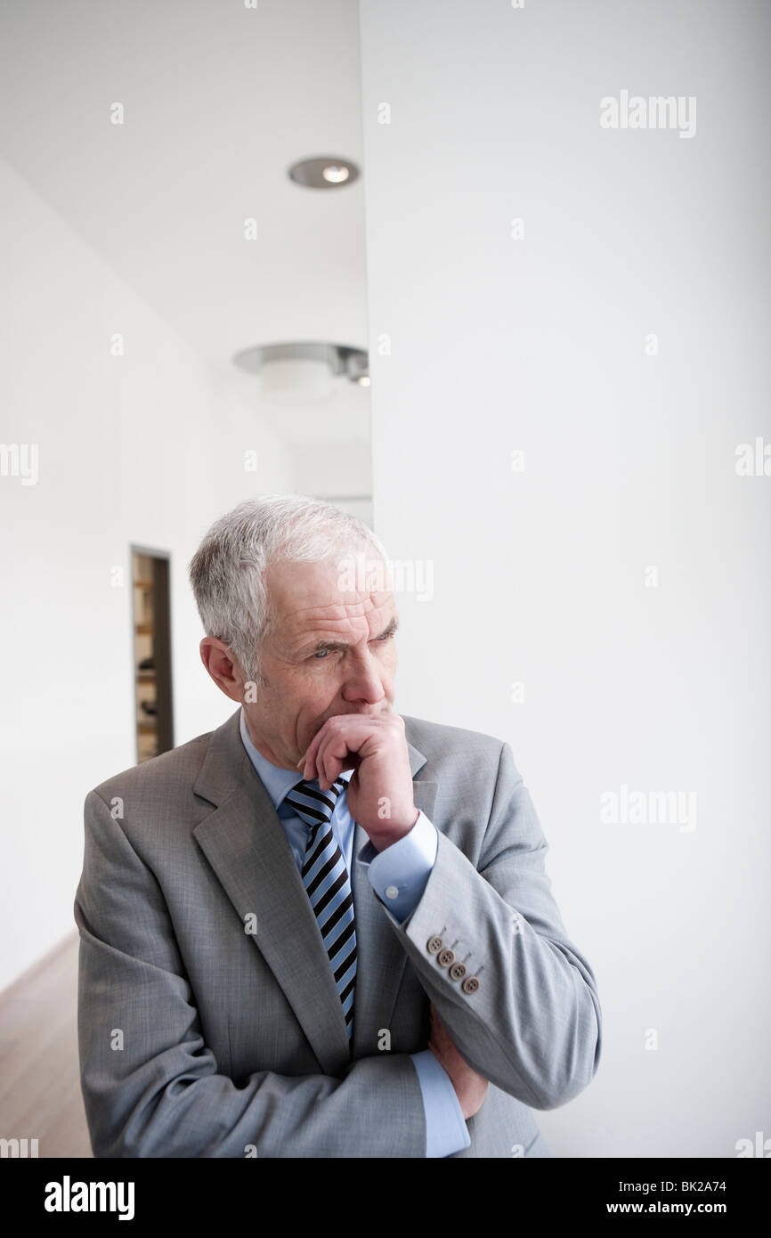 Caucasian businessman pondering problem hi-res stock photography and ...