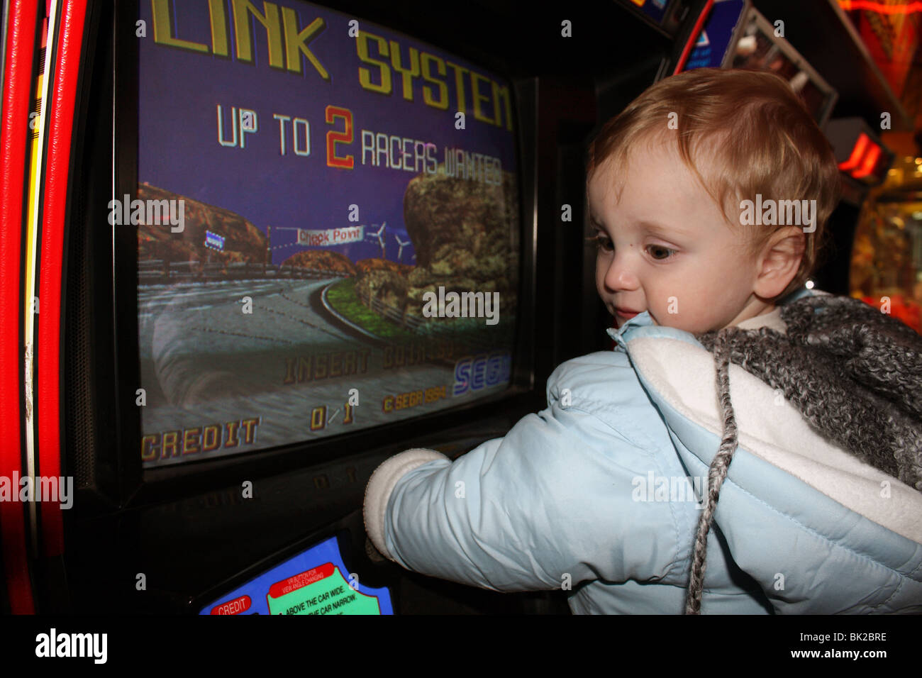 A young baby boy; just one year old entertaining himself by playing on ...