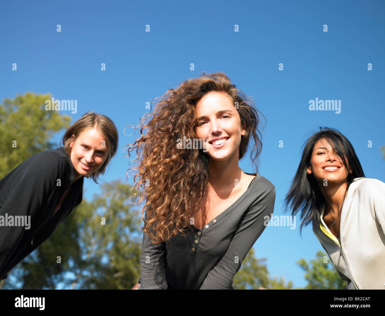Women looking into the camera, smiling Stock Photo - Alamy