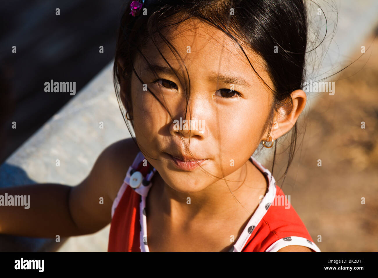 Little girl in the village by the lake north of Mui Ne in Vietnam Stock ...