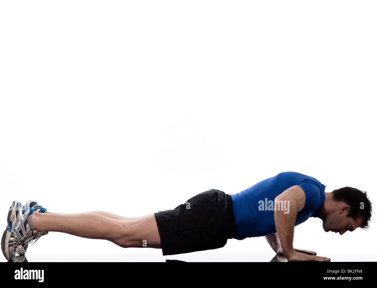 man doing push up abdominals workout posture on isolated white ...