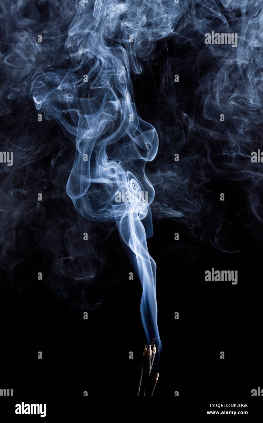 Incense smoke, abstract shape on black background Stock Photo - Alamy