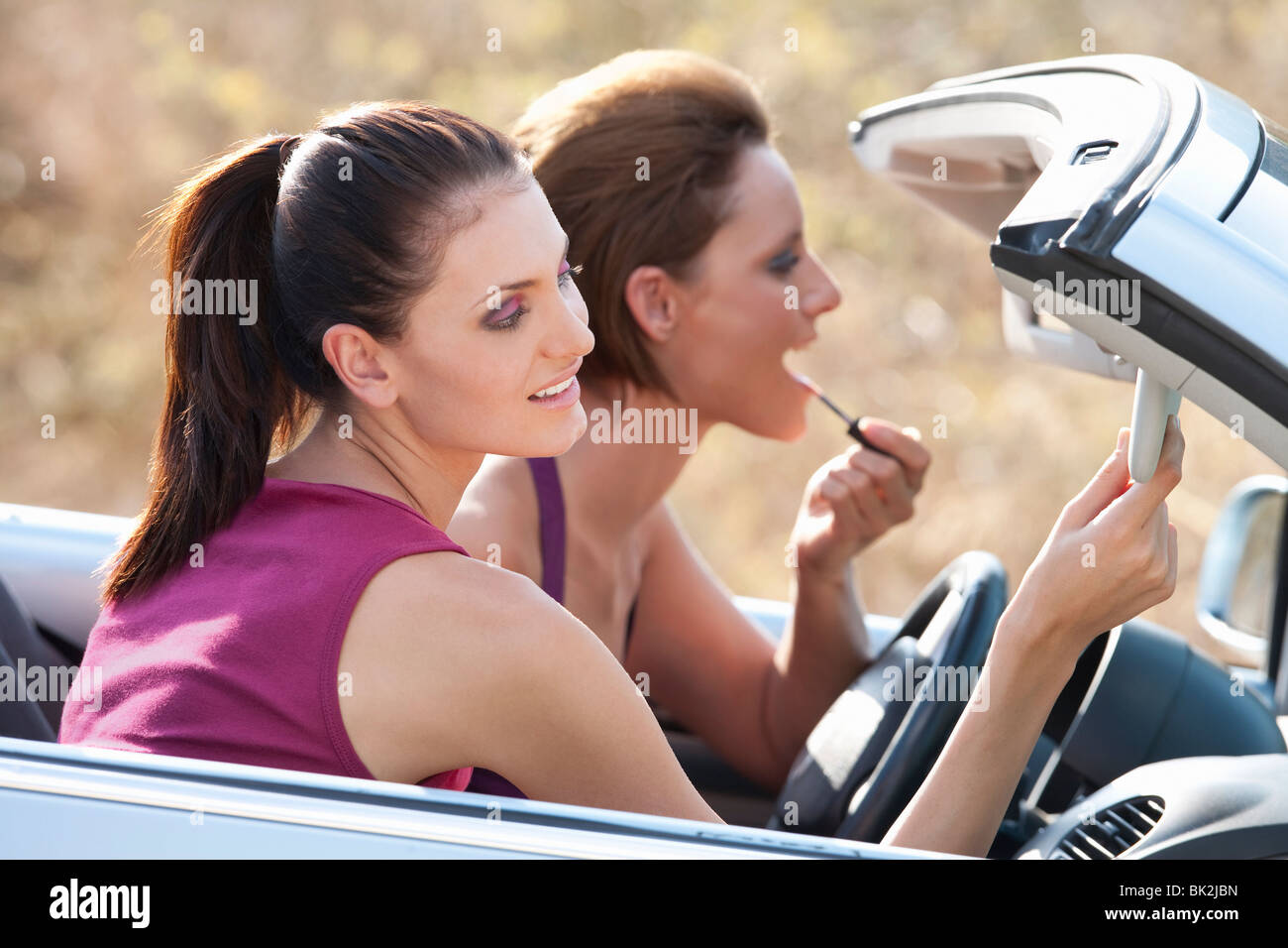 Women doing their make up in a car Stock Photo - Alamy