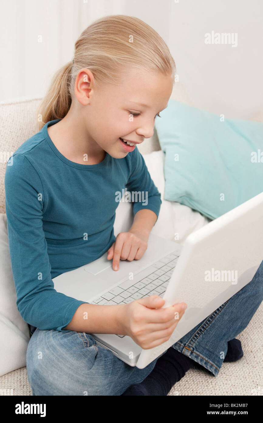 Girl using a laptop Stock Photo - Alamy