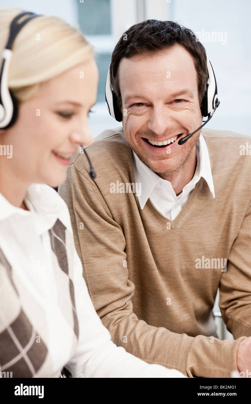 Man and woman in call center Stock Photo - Alamy
