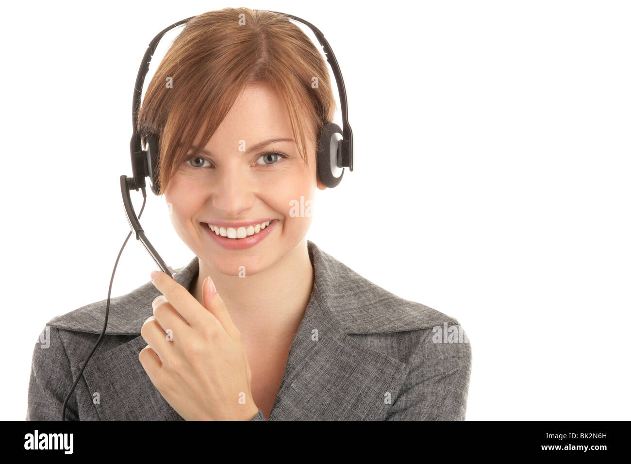 Young telephone operator wearing headset isolated on white background ...
