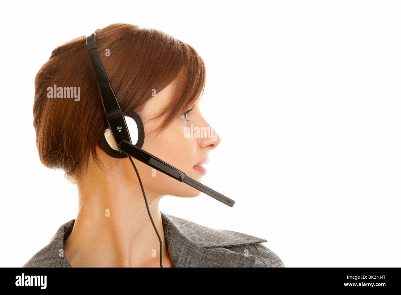 Young telephone operator wearing headset isolated on white background ...
