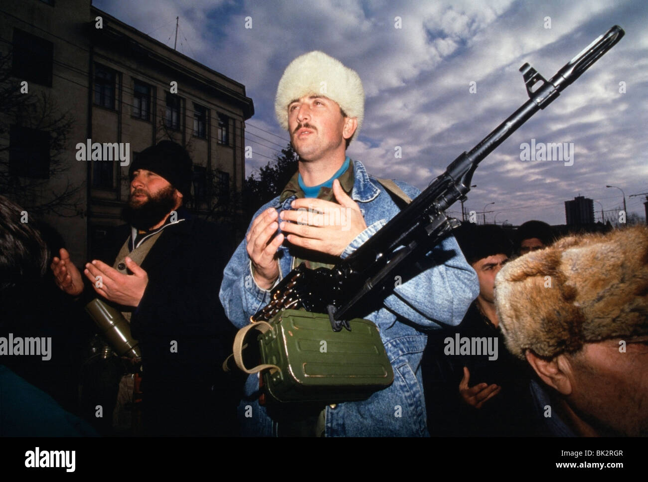 Dudayev supporters during afternoon Prayers outside the "Presidential ...