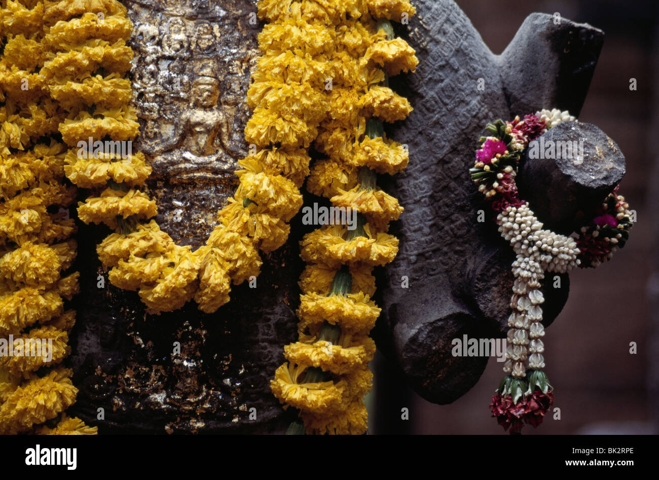 Detail of Khmer statue adorned with flowers, Prasat Muang Singh ...