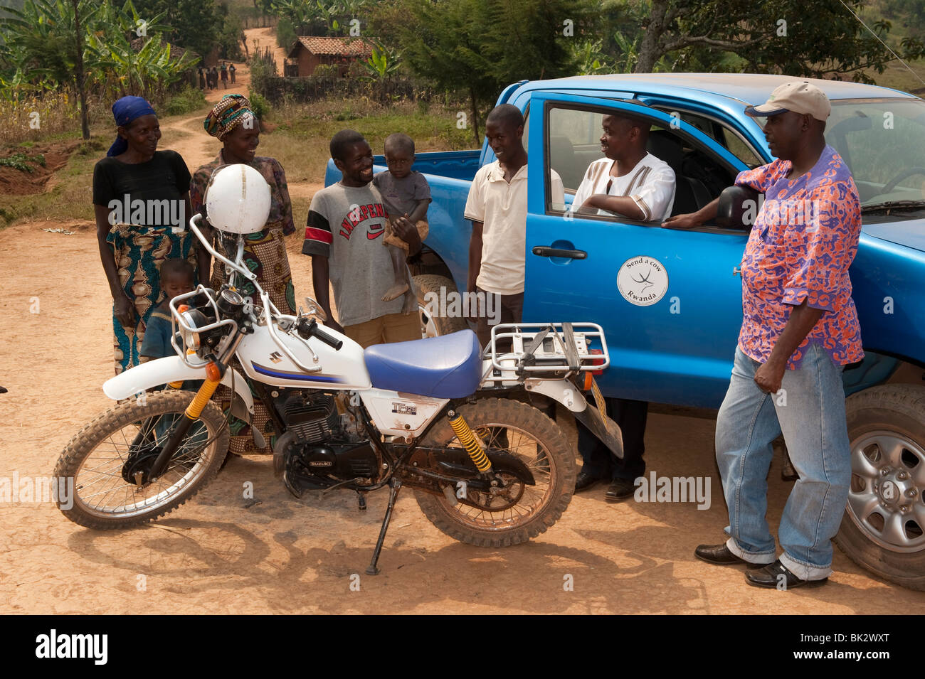 Aid workers talking to local community members, Rwanda Stock Photo - Alamy