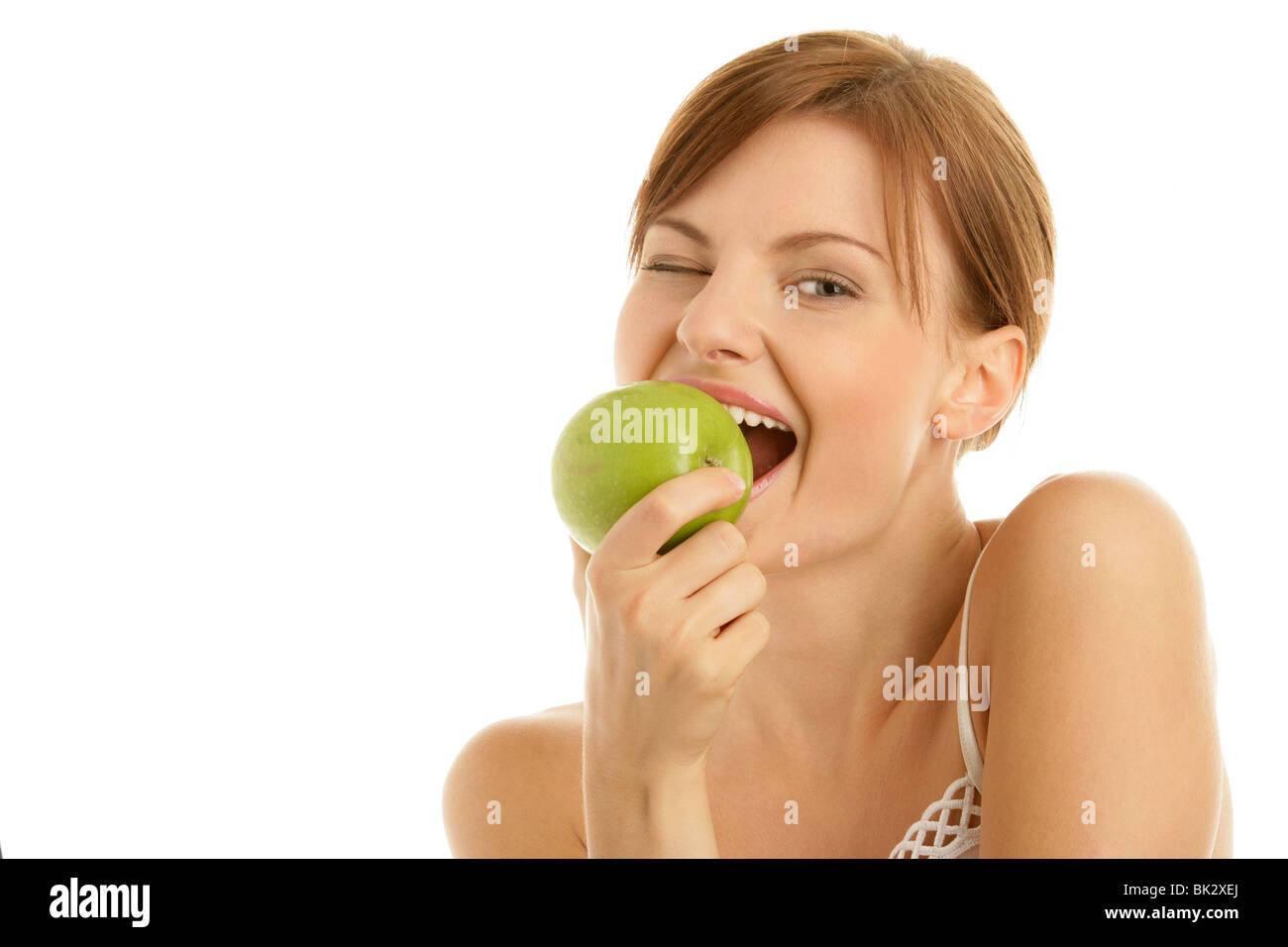 Young woman eating green apple isolated on white background Stock Photo ...